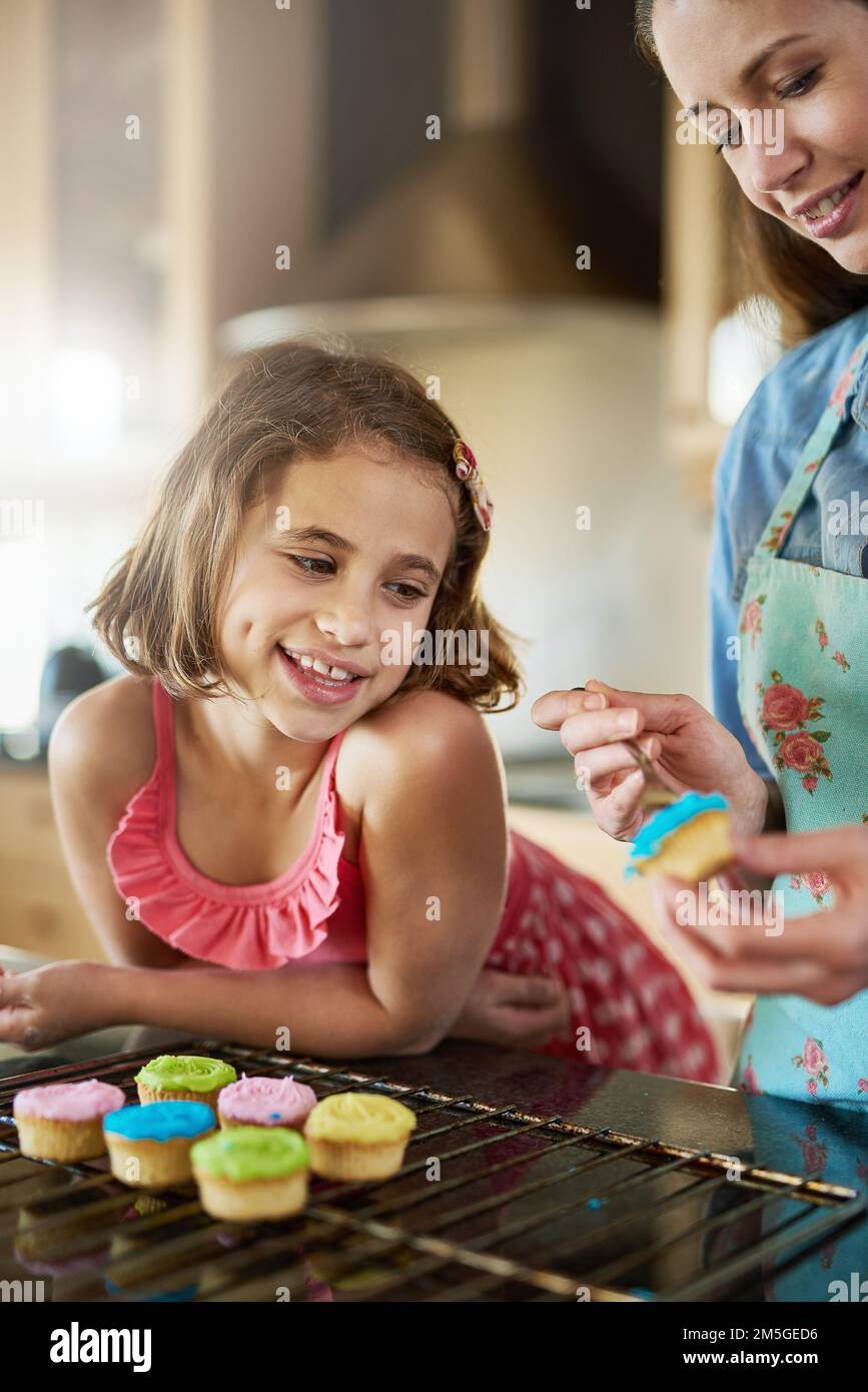 Decorating lessons from a true expert. a little girl watching her ...