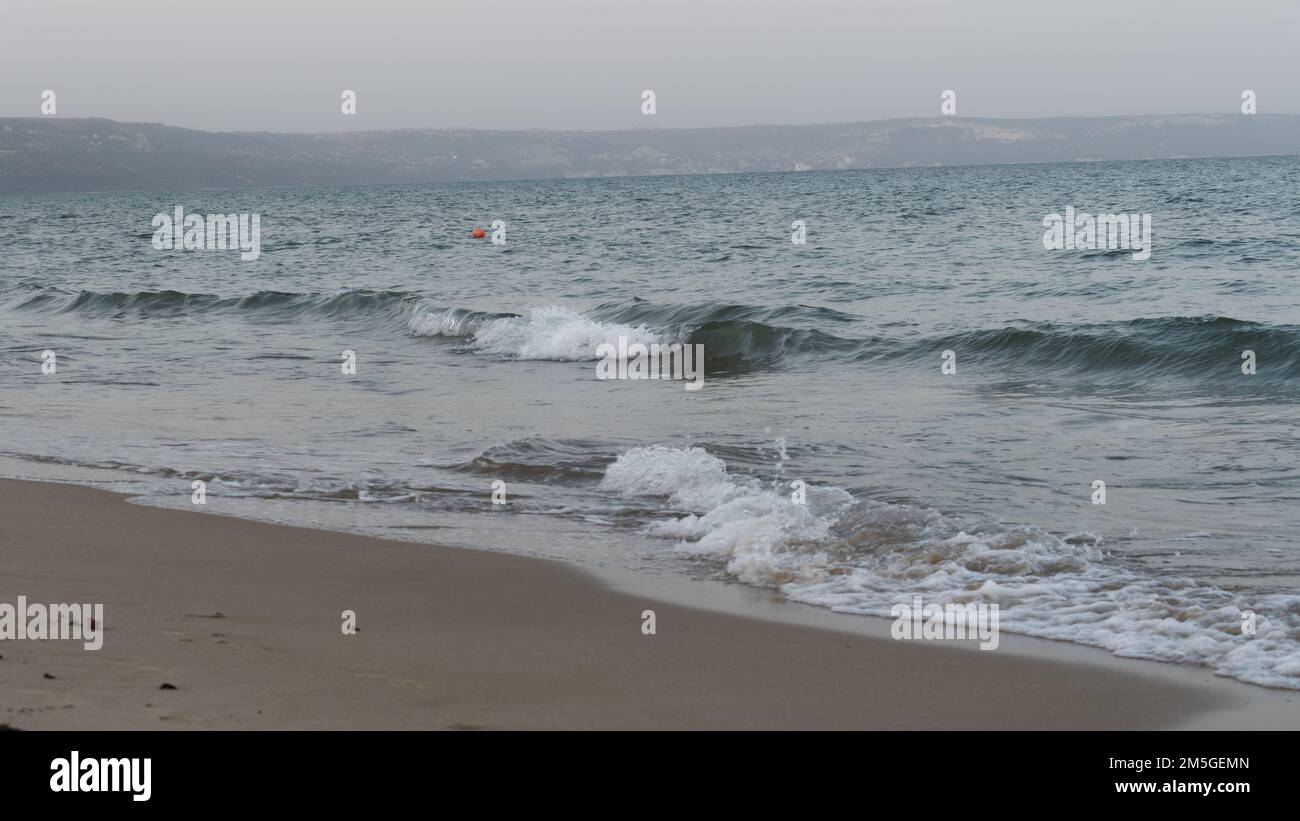 Gentle surf on a late afternoon Stock Photo - Alamy
