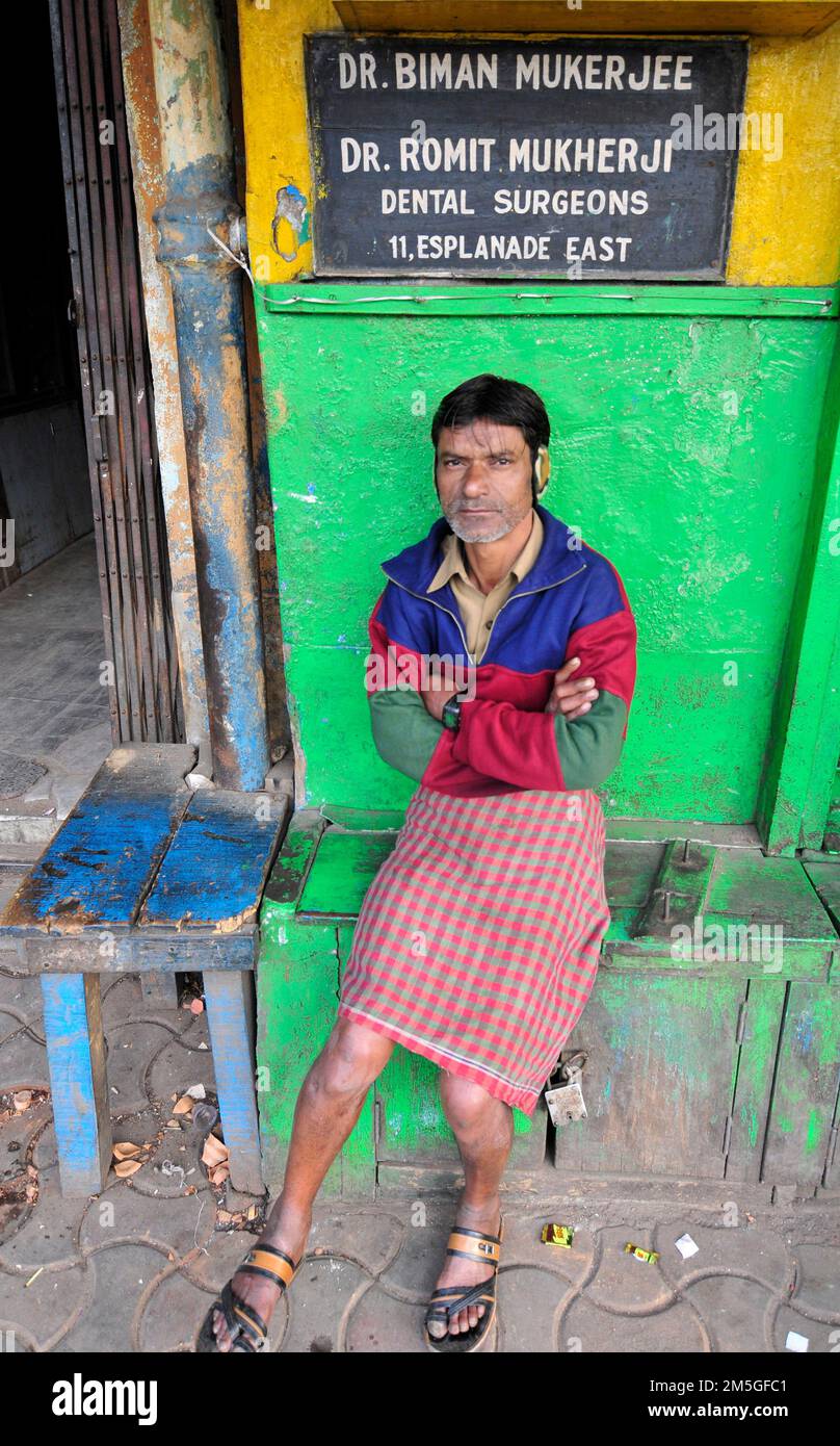 A smiling Bengali man dressed in a traditional lungi. Kolkata, India ...