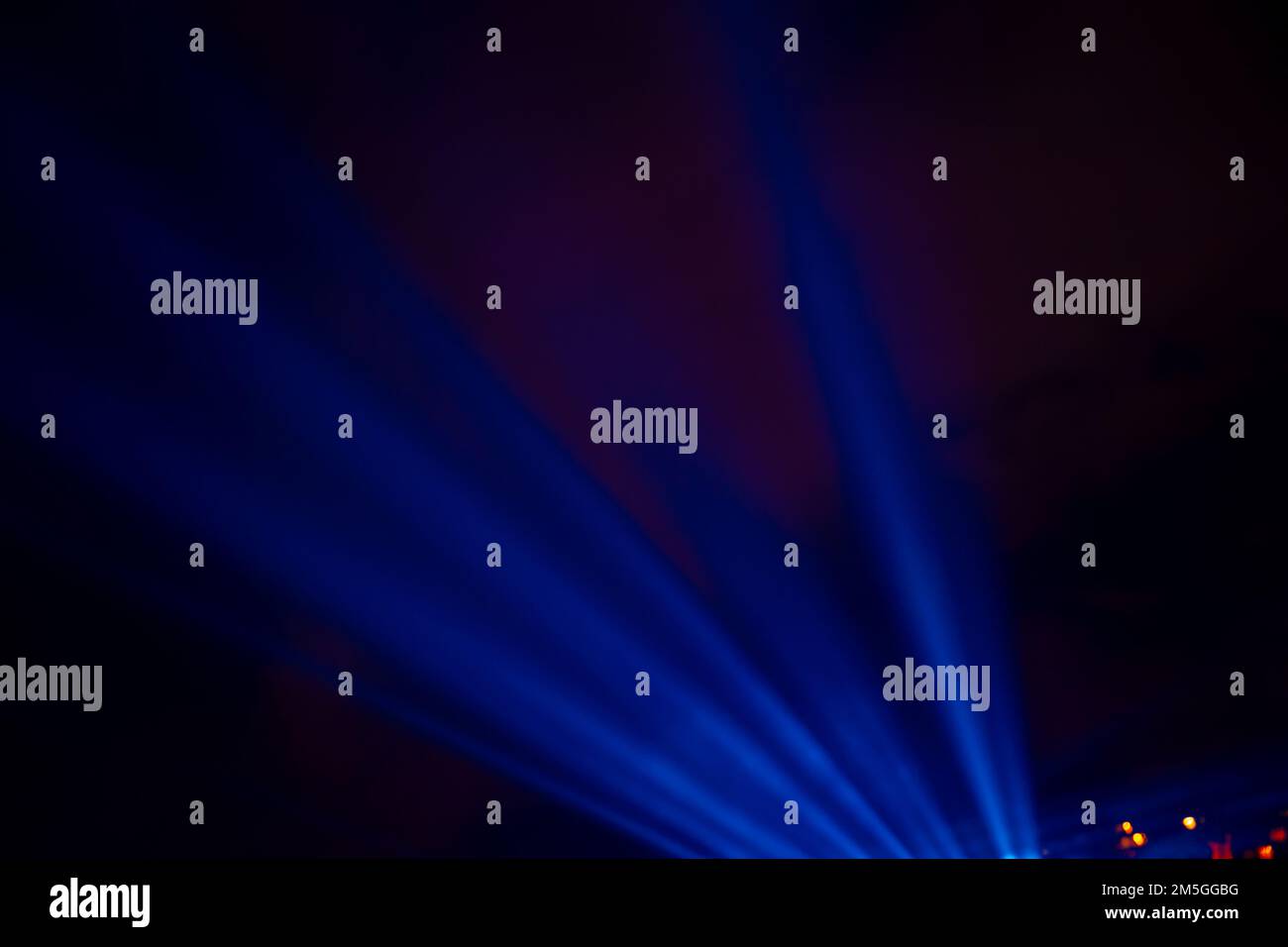 Blue spotlight rays. Projector light rays background photo. Event or ...