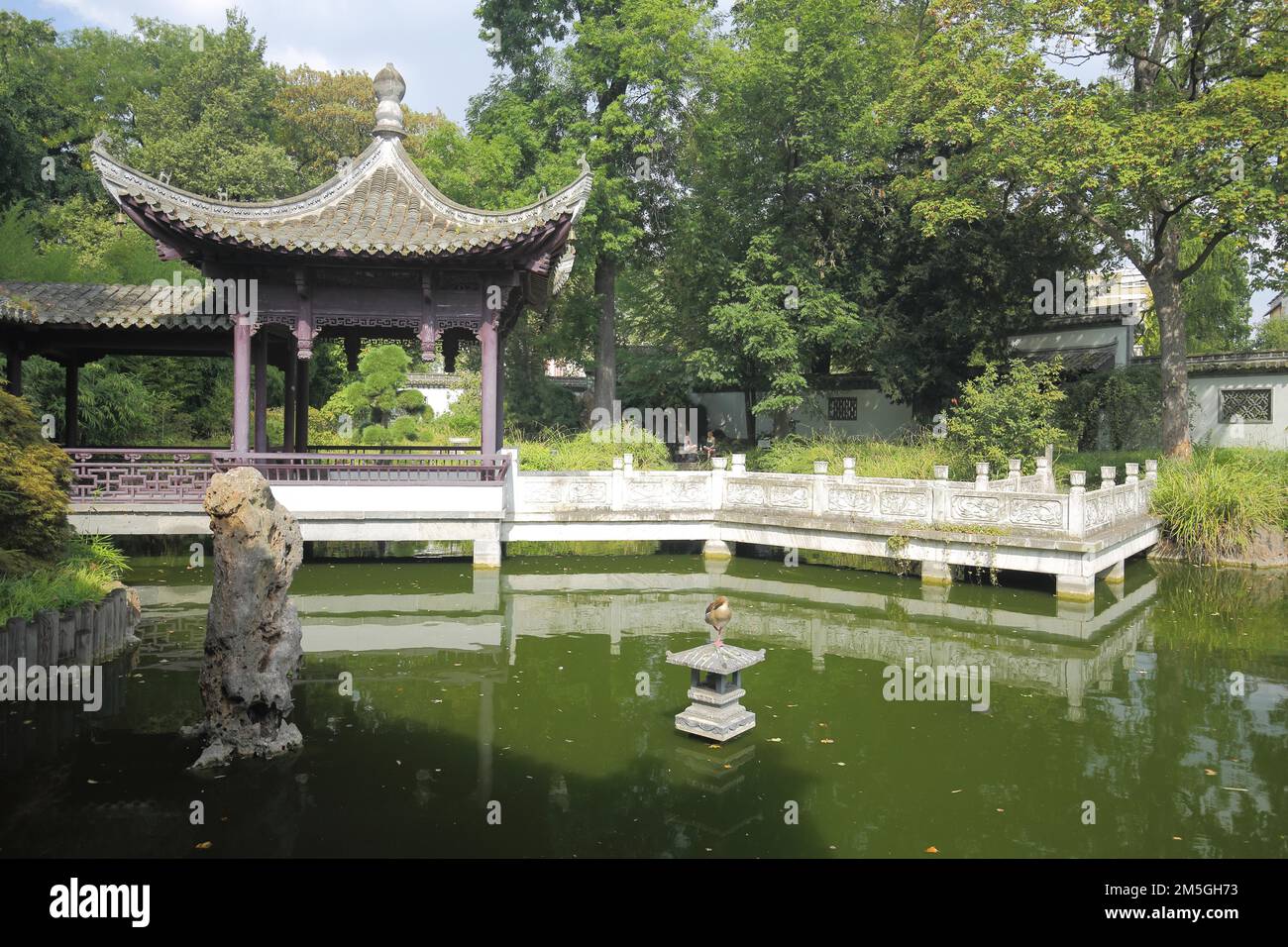 Temple with pond in the Chinese Garden, Garden of Heavenly Peace ...