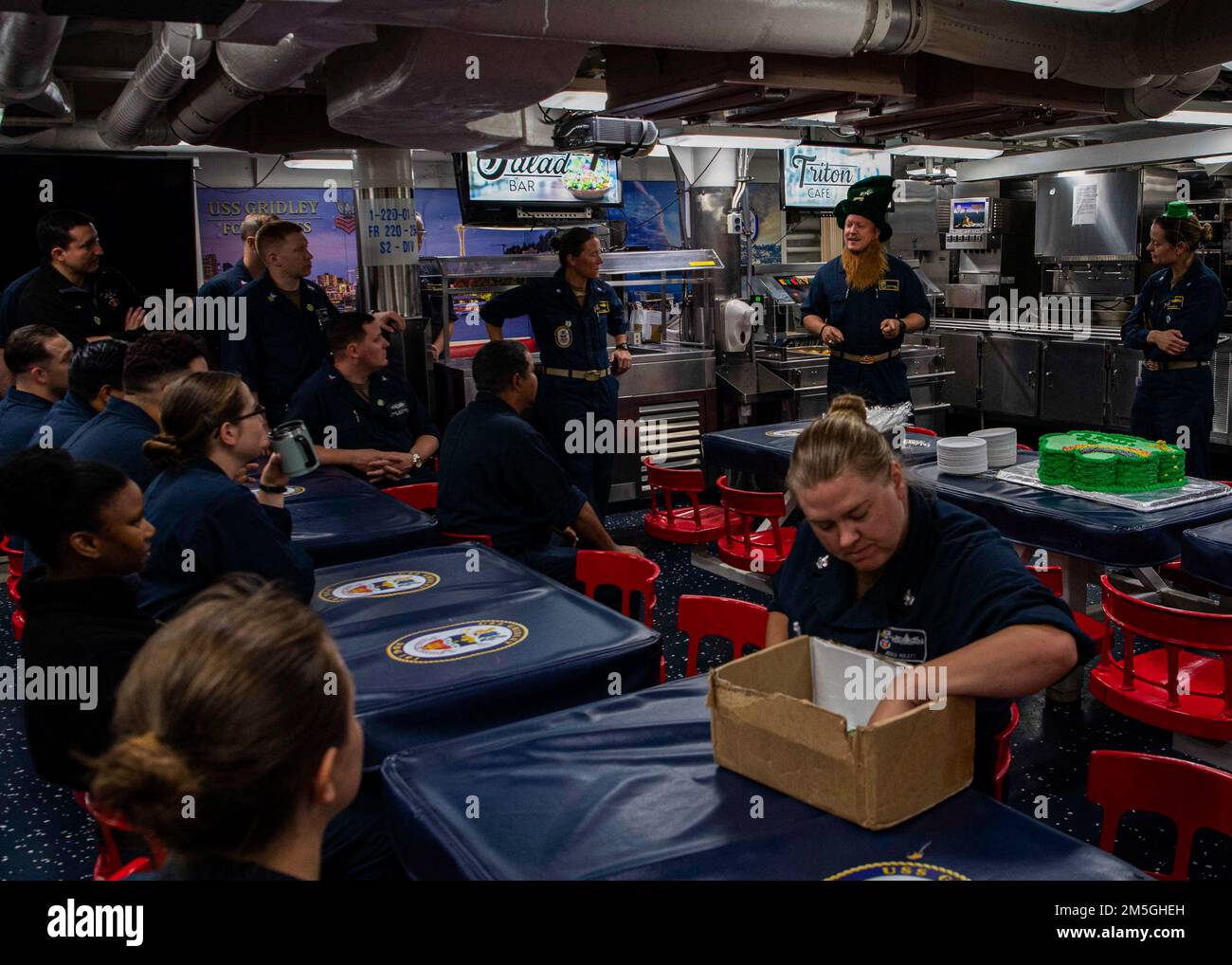 ARABIAN GULF (March 17, 2022) Lt. Ross Engel, right, ship’s chaplain ...