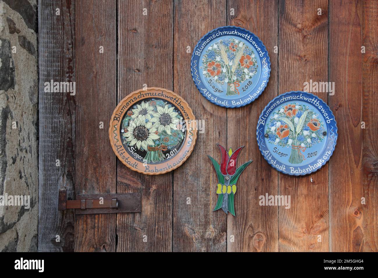 Three painted and decorative plates as award, prize, profit for at ...