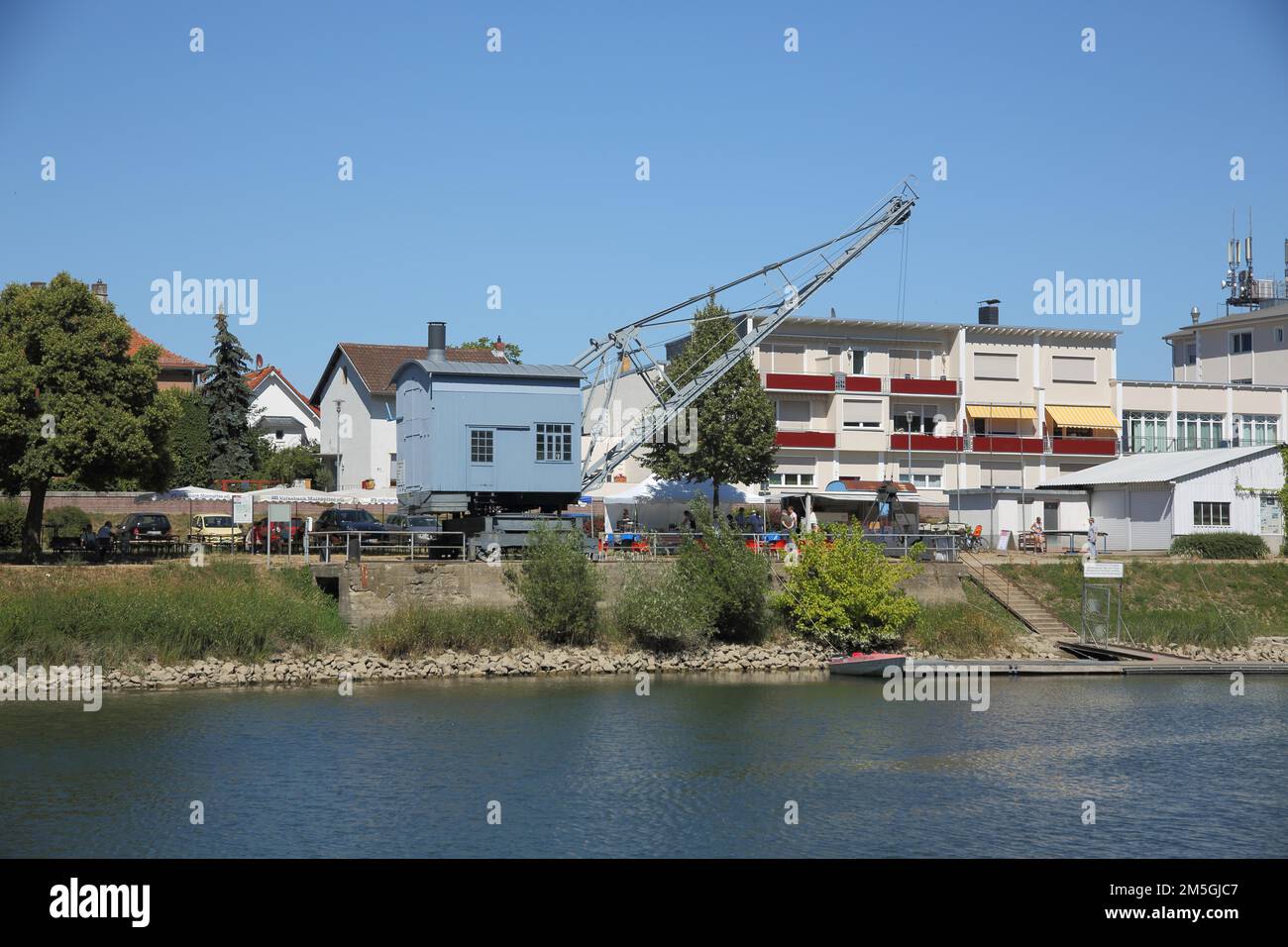 Historic gravel dredger, load crane at the harbour of the Altrhein in ...