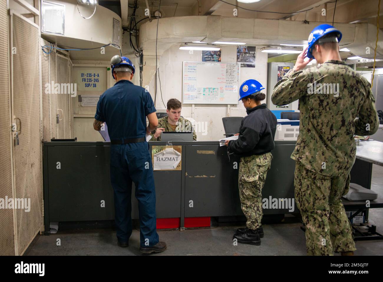 U.S. Navy Sailors check out hazardous material used for maintenance ...