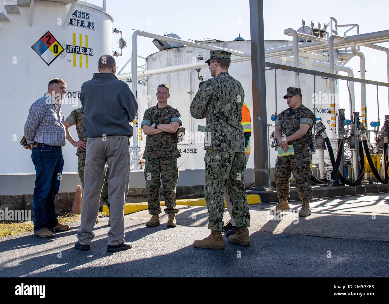 U.S. Marine Corps Col. Mikel Huber, center, Marine Corps Air Station ...