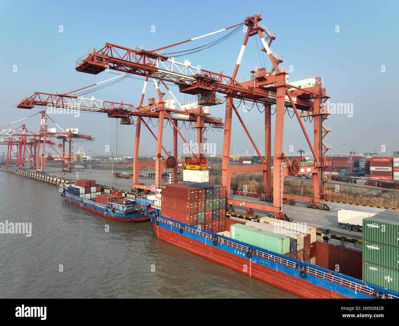 Aerial photo shows cargo ships loading and unloading containers at the ...
