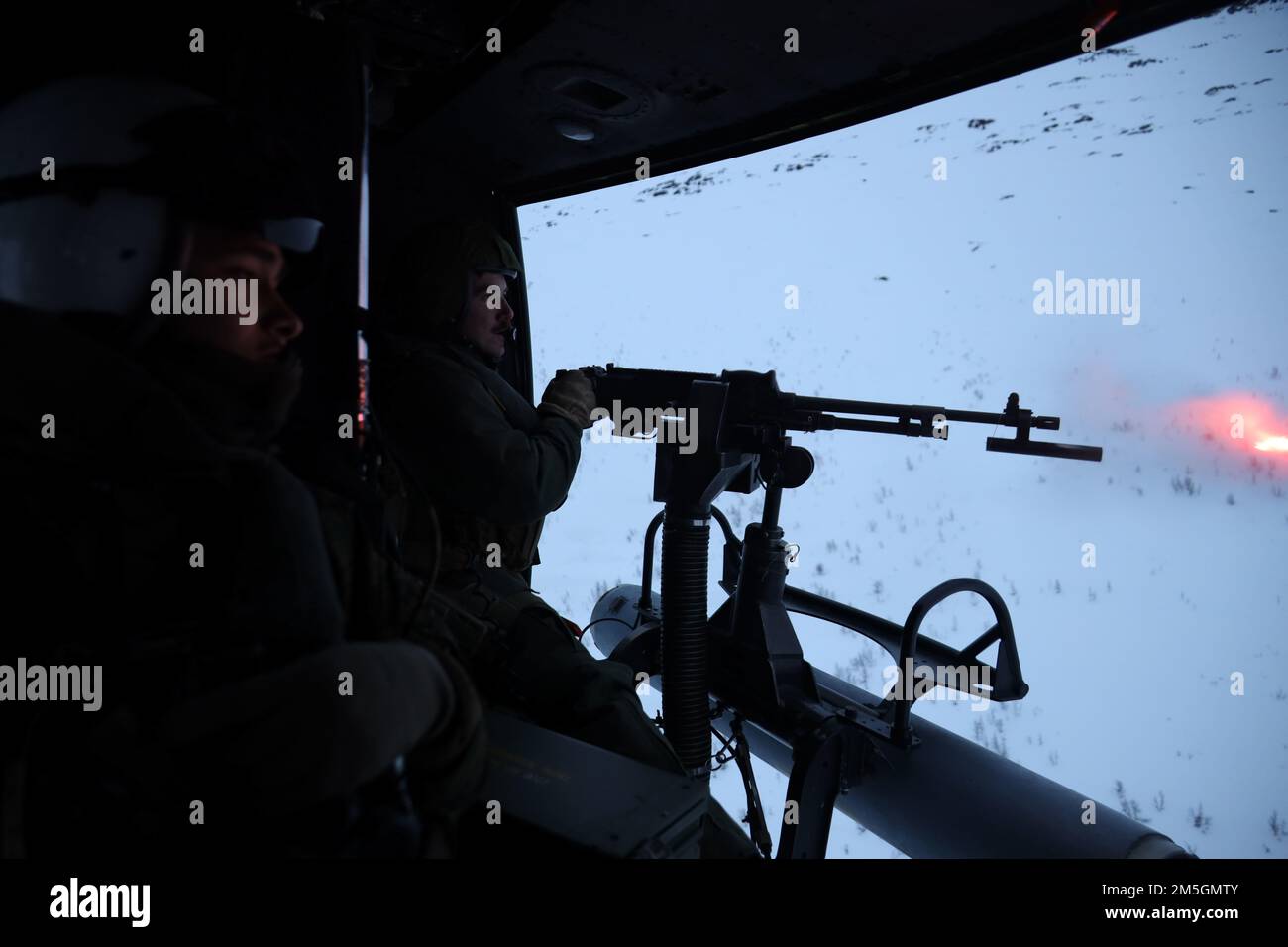 U.S. Marine Corps Sgt. Christopher Stump engages a target with a M240B ...