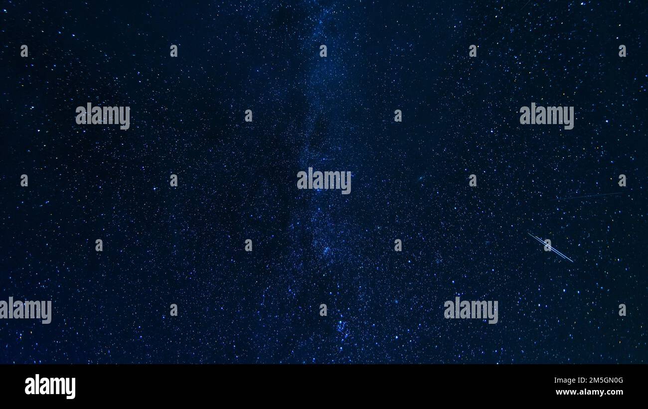 blue starry night sky with the milky way and galaxies. Astrophotography ...