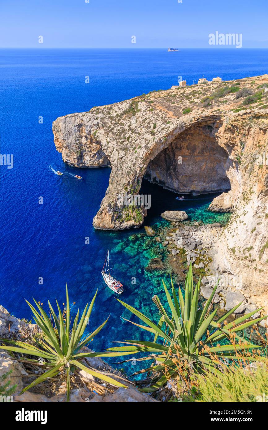 Blue Grotto in Malta. The sea cave is located near Wied iż-Żurrieq ...