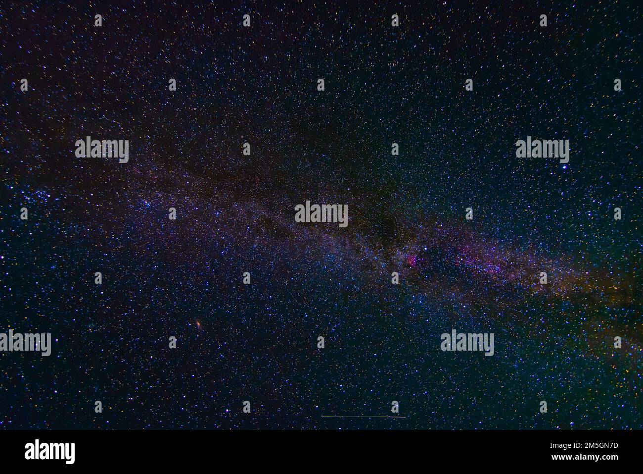starry multicolored night sky with a bright milky way and galaxies ...