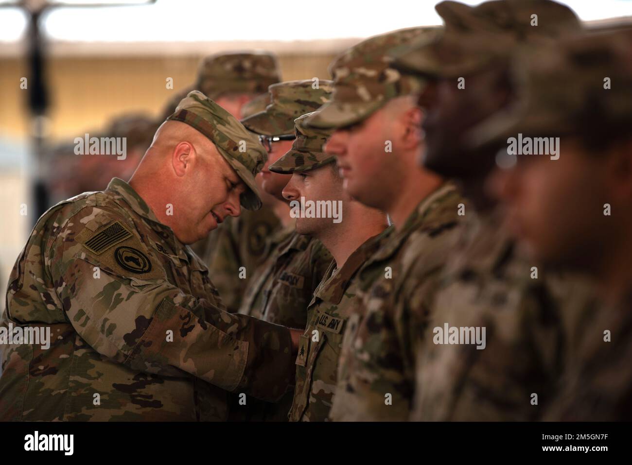 Members of the 404th Maneuver Enhancement Brigade receive their combat ...