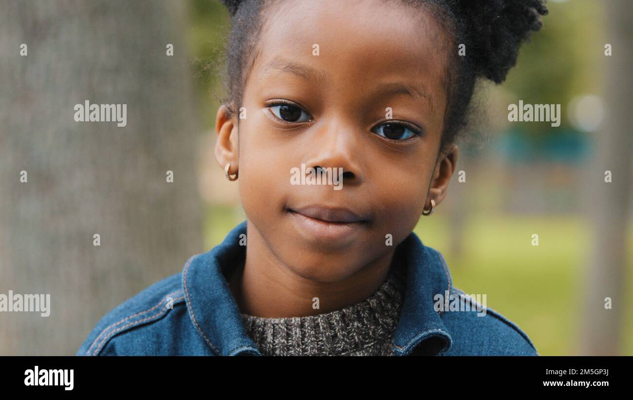 Little African American girl outdoors close-up child pretty smiling ...
