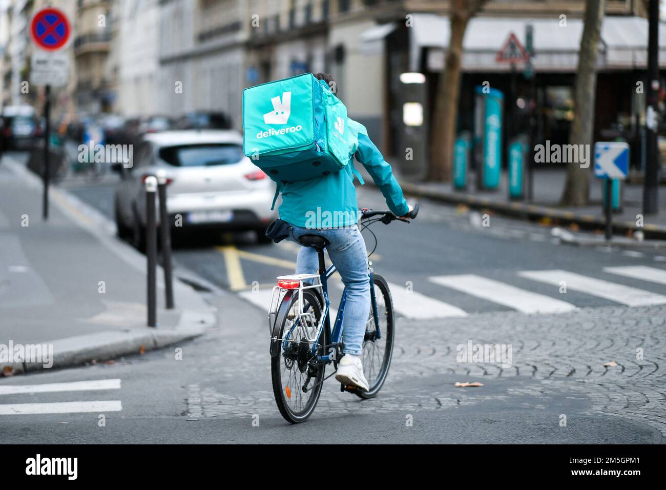 Illustration picture shows a deliver (man) for Deliveroo on his bike (bicycle). Illustration of ...