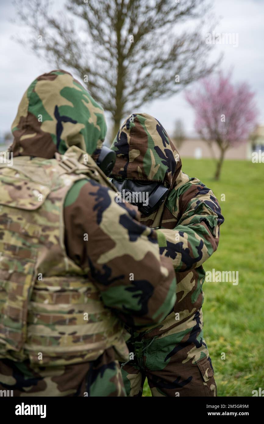 U.S. Soldiers assigned to the 39th Strategic Signal Battalion don their ...