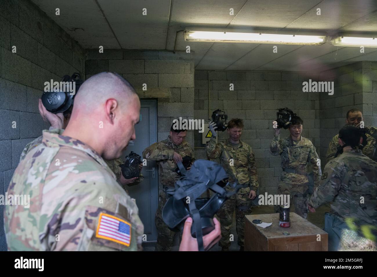 U.S. Soldiers assigned to the 39th Strategic Signal Battalion remove ...