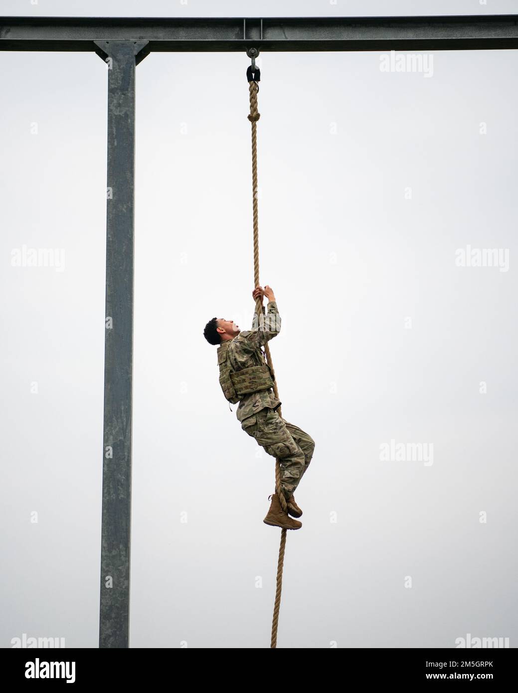 A U.S. Army paratrooper assigned to the 173rd Airborne Brigade climbs a ...
