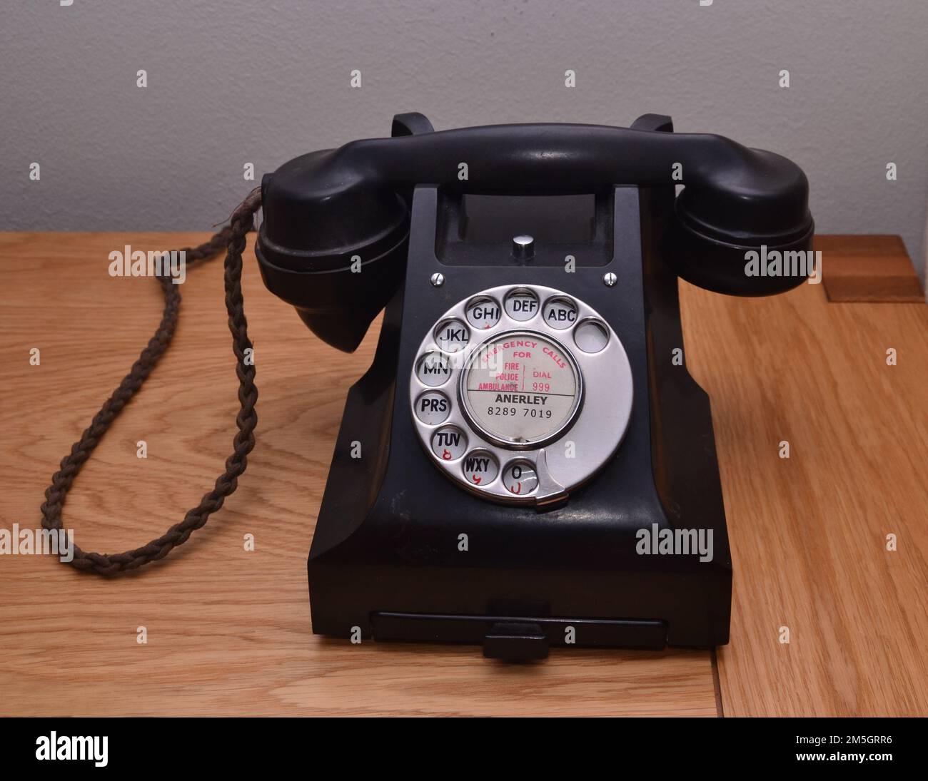Old vintage, black, rotary dial phone or telephone, used in the past to ...