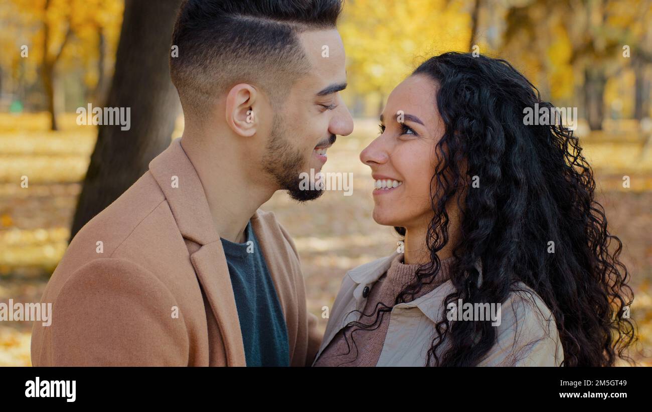 Multiracial ethnic Hispanic happy married couple in love standing ...