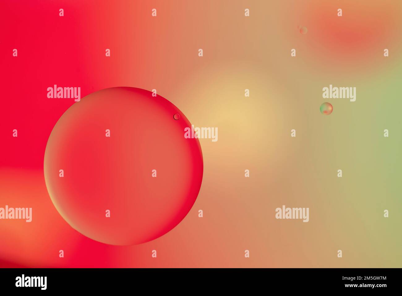 Colourful light diffraction patterns formed by oil droplets floating on ...