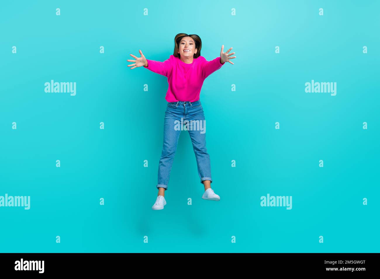 Full length photo of shiny excited girl dressed pink pullover jumping ...