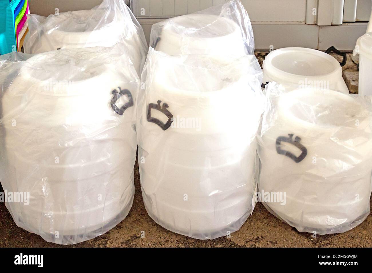 Empty white plastic barrels used for food preservation Stock Photo - Alamy