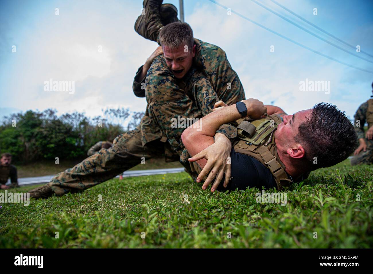 U.S. Marine Corps Staff Sgt. Tyler Thomas, right, a weapons platoon ...