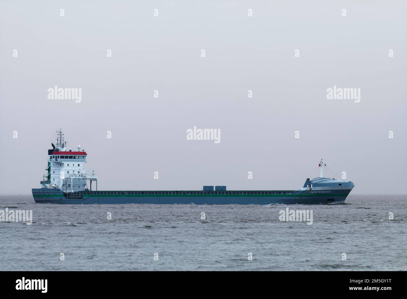 General cargo vessel heading into port Stock Photo - Alamy