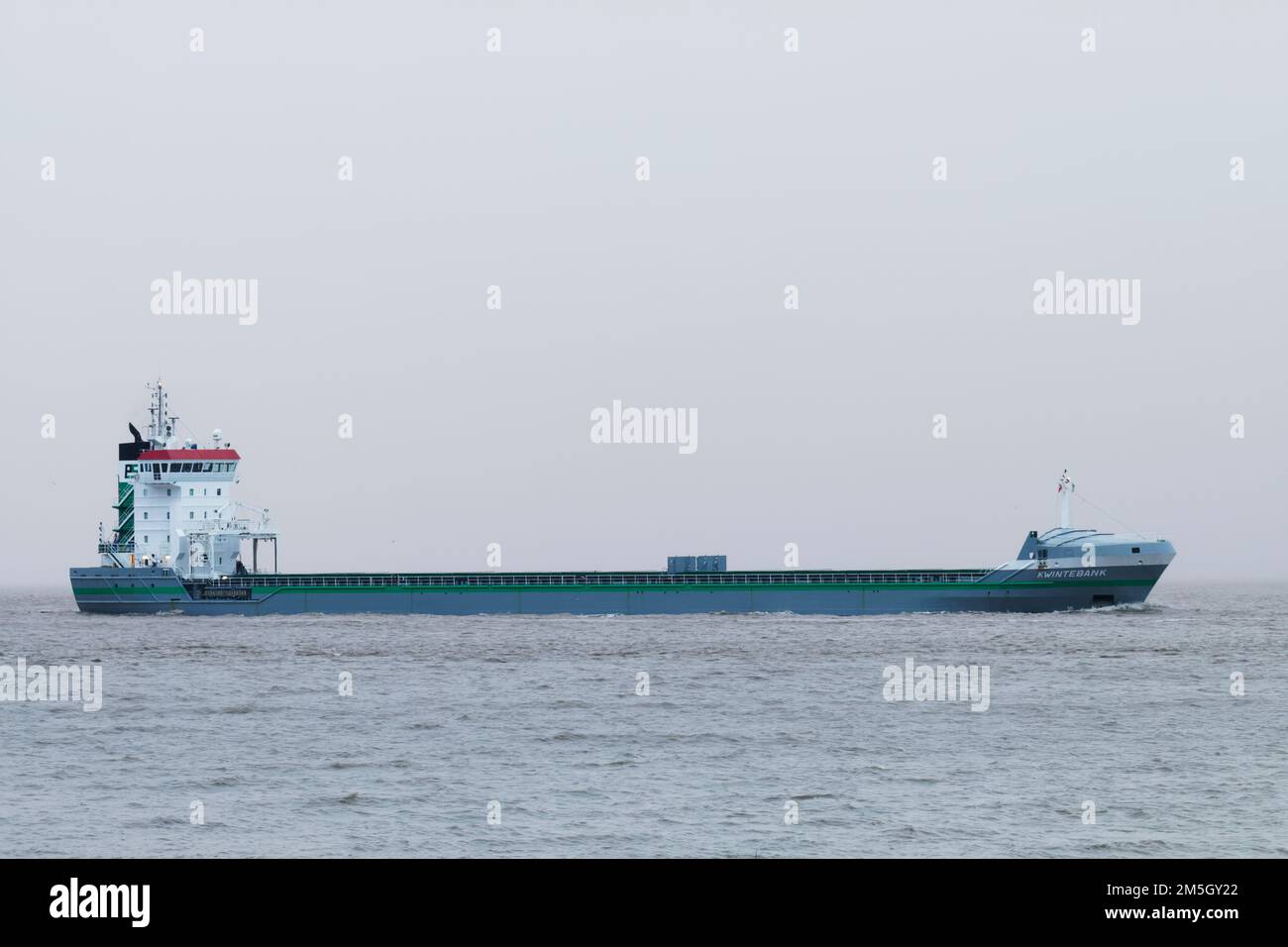 General cargo vessel heading into port Stock Photo - Alamy