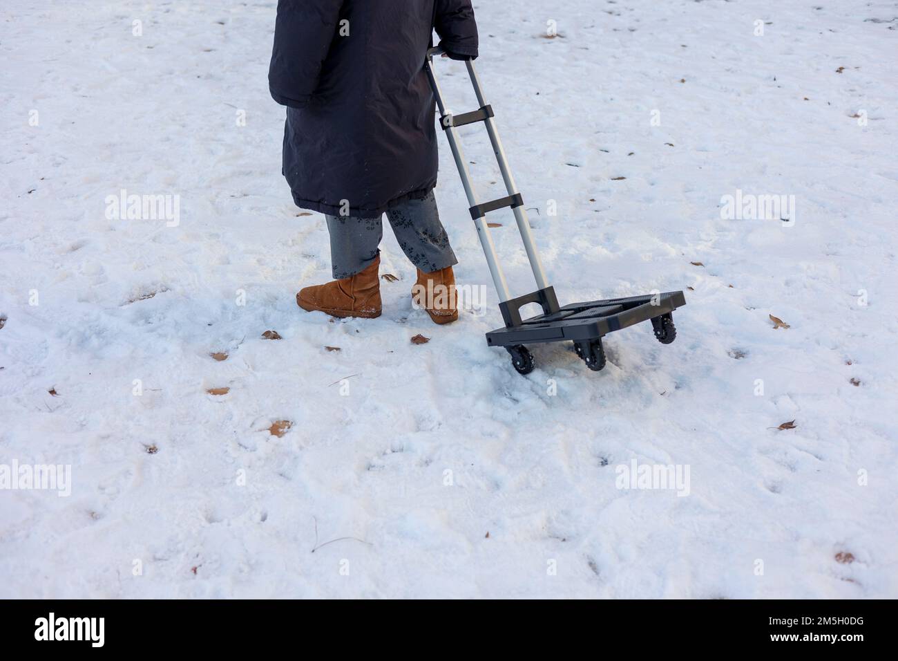 Dragging a cart hi-res stock photography and images - Alamy