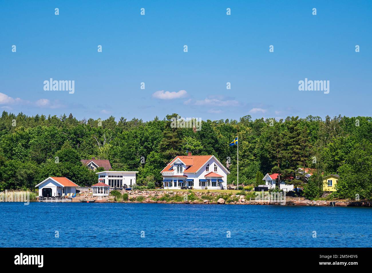 Baltic Coast With Trees And Houses Near Uvö Island In Sweden Stock ...