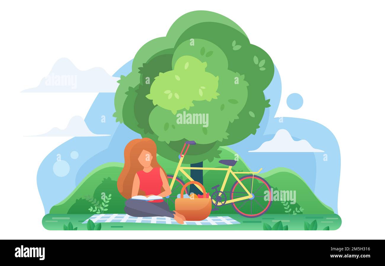 Young woman reading book under tree, student studying outdoors in park ...