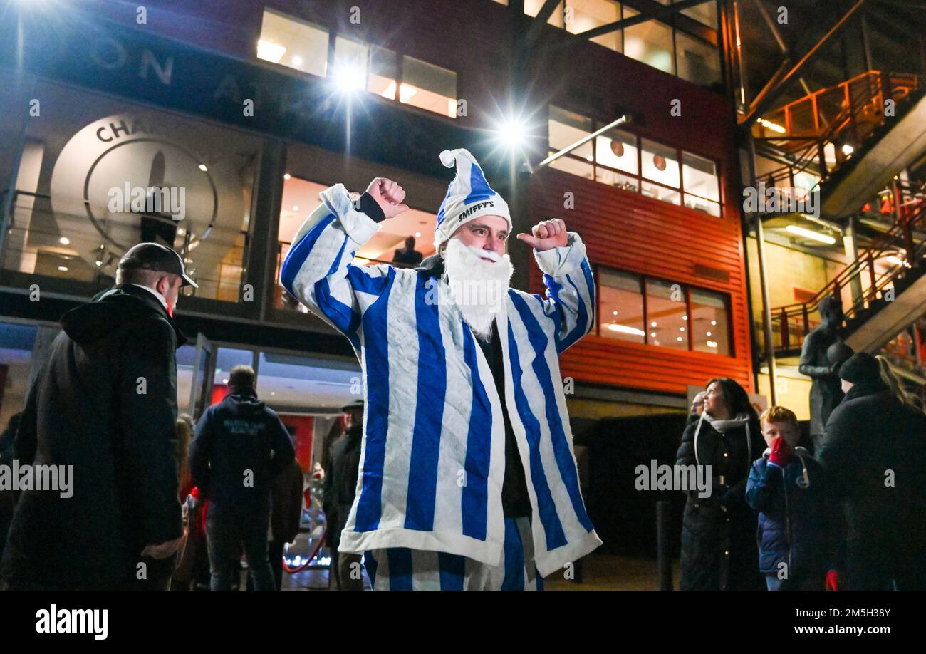 Brighton & Hove Albion football fan wearing a Santa Claus costume Stock ...