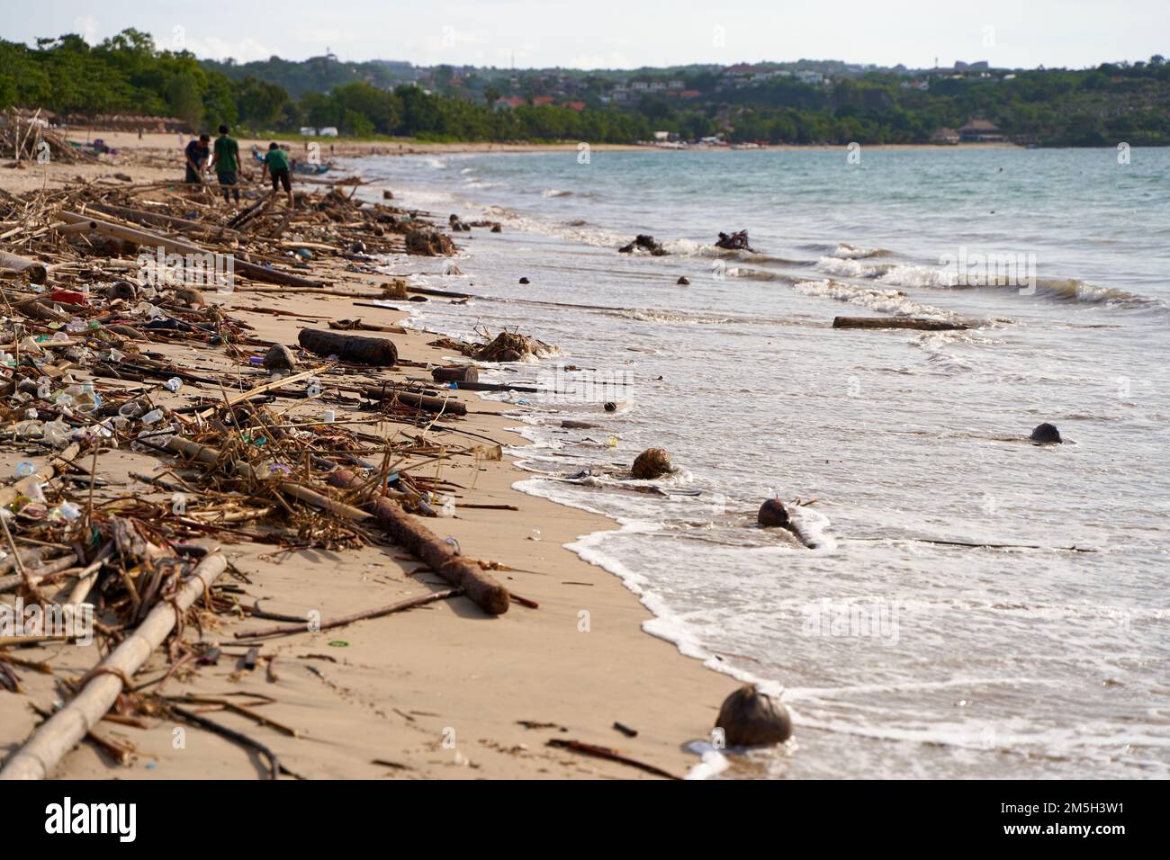 Mountains of waste and garbage on the sandy beach after the tide ...