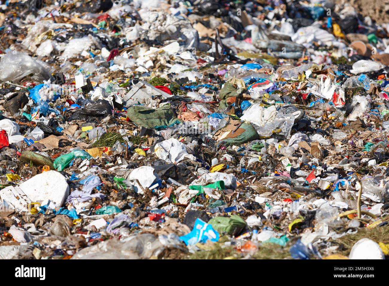 Open air garbage dump. Plastic pollution. Recycling junk. Consumerism ...