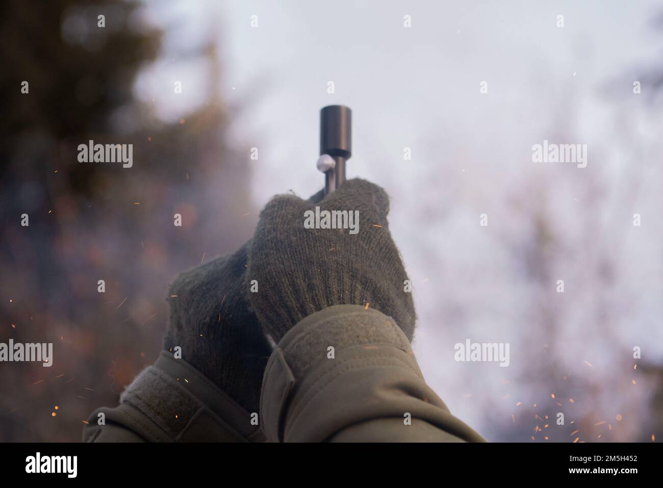 An Arctic Survival School student fires a signaling device March 17 ...