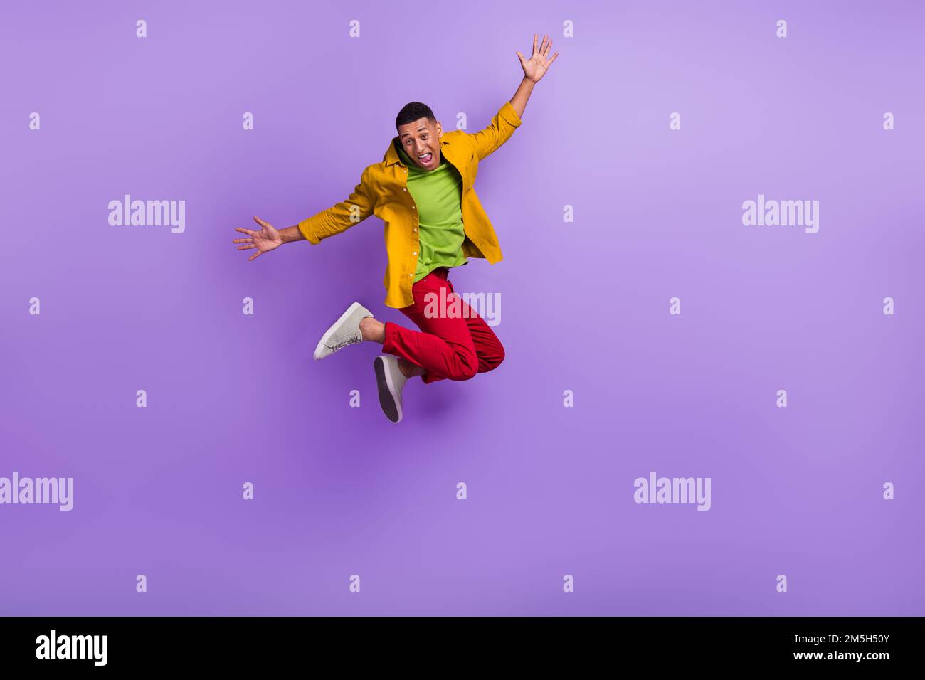 Full body photo of active overjoyed person jumping raise hands isolated ...