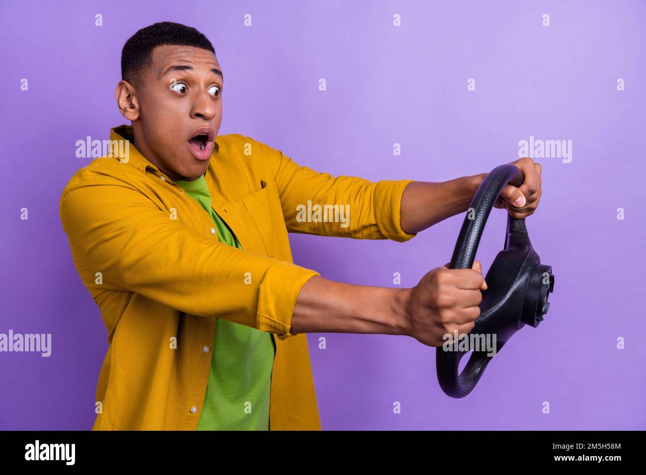 Photo portrait of attractive young male hold rudder frightened ...