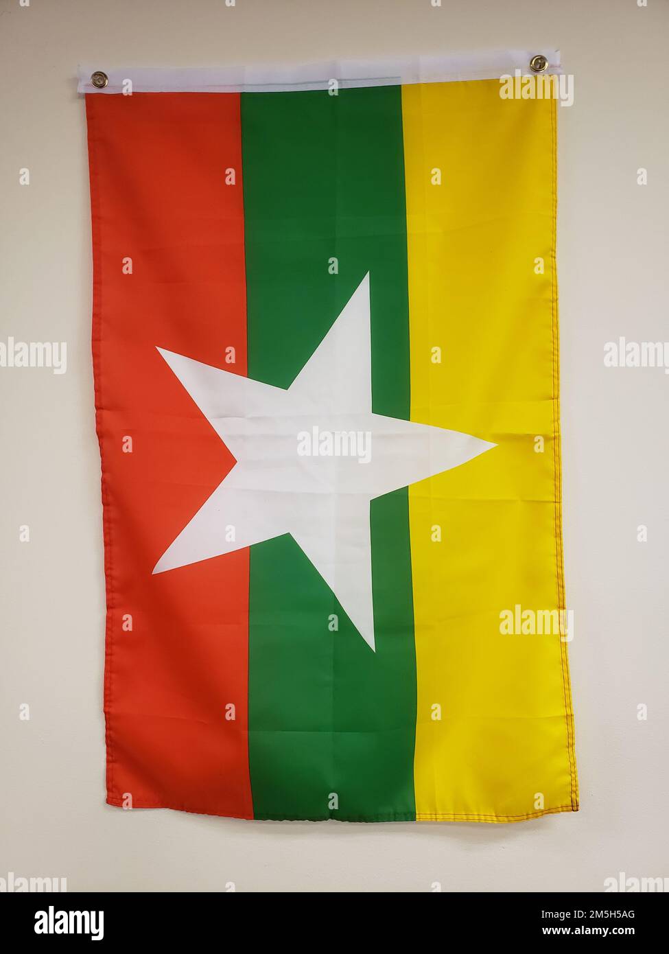 the Flag of myanmar hanging vertically Stock Photo - Alamy