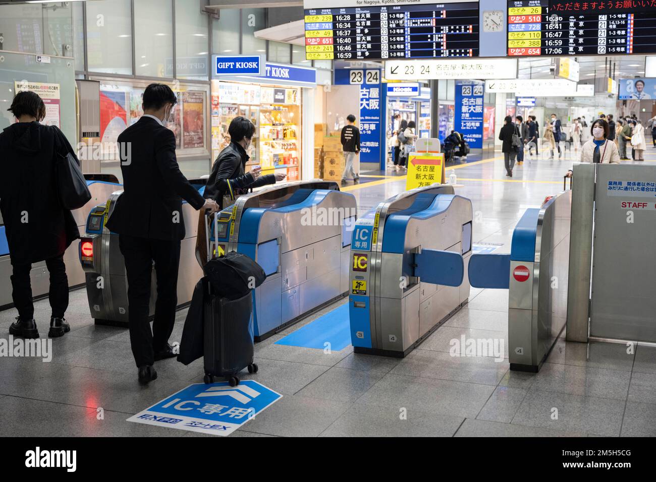 Tokyo, Japan. 30th Nov, 2022. Passengers pass through the Shinkansen ...