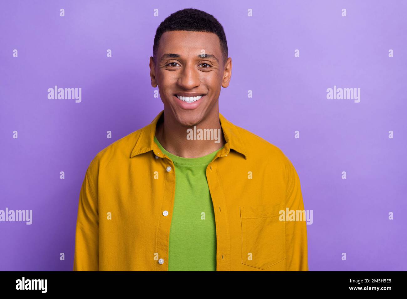 Photo of cheerful charming guy dressed yellow shirt smiling showing ...