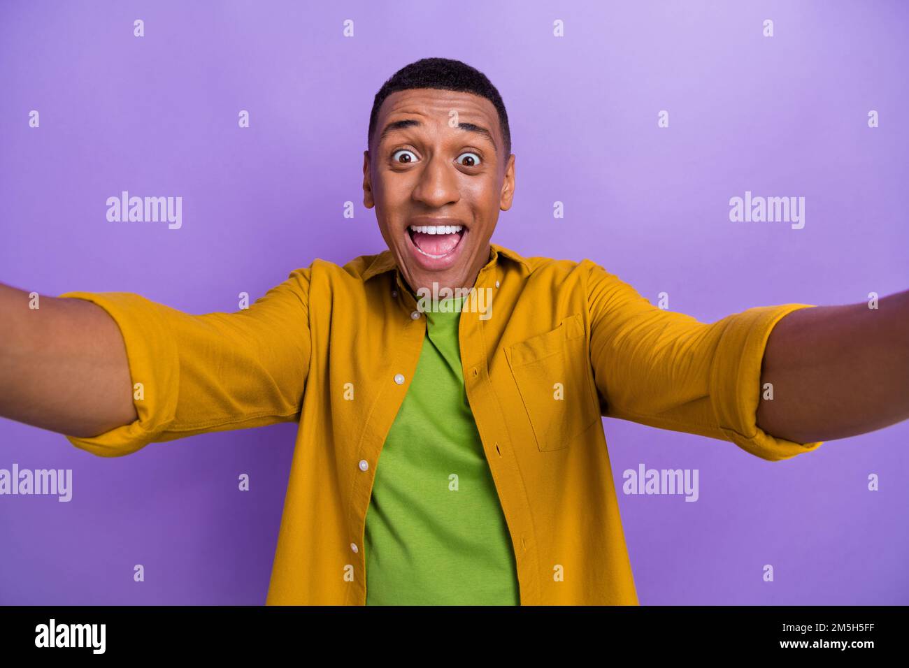 Photo portrait of attractive young male crazy excited take selfie front ...