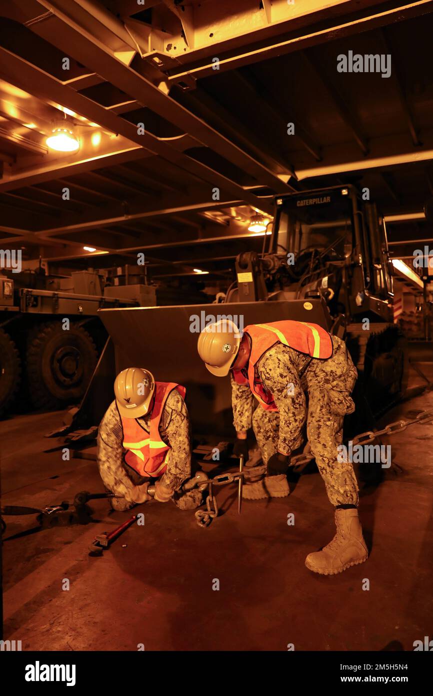 U.S Navy Sailors Petty Officer 2nd Class Logan Bowers, right, and Petty ...