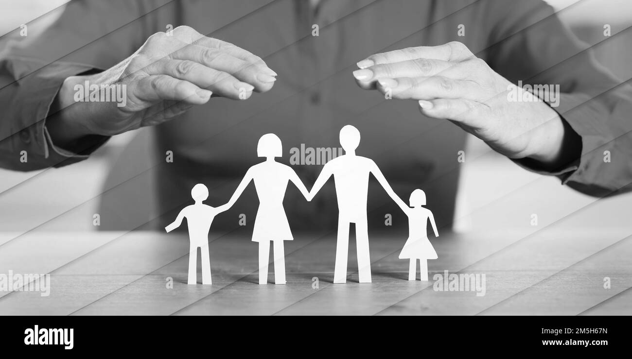 Insurer protecting family with his hands, geometric pattern Stock Photo ...