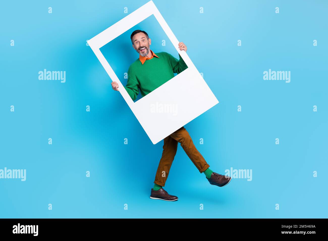 Full length photo of mature nice mister walking posing photo zone frame ...
