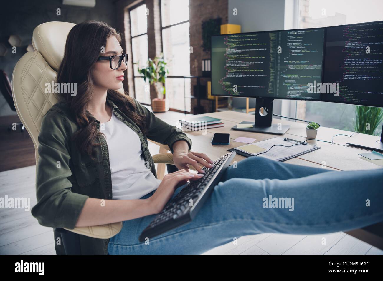 Photo of busy intelligent lady coder wear spectacles typing keyboard indoors workplace workshop ...