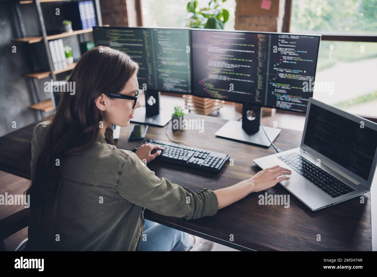 Photo of smart lady nerd working startup site program typing key words ...