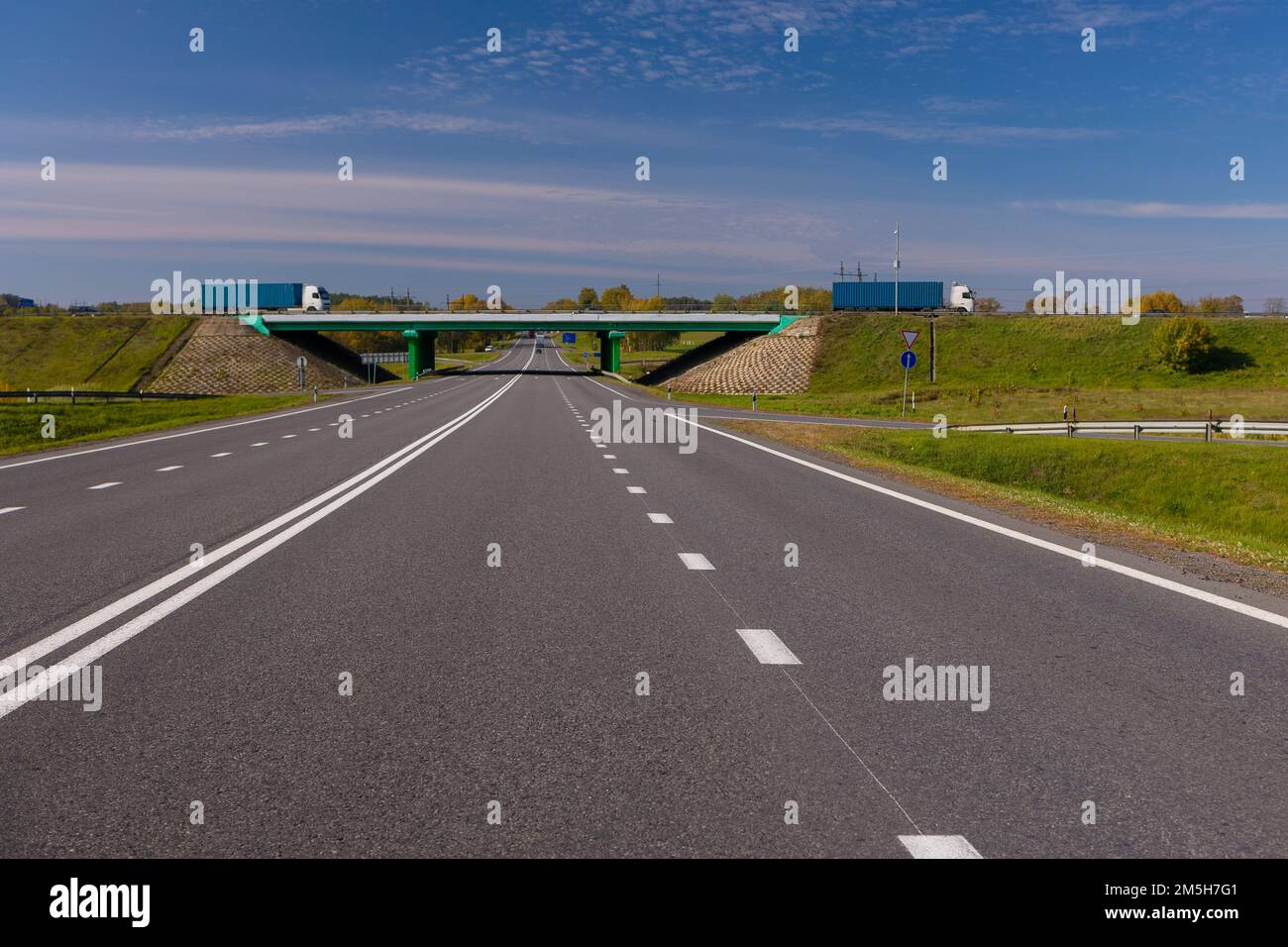 Bridge, roadside and asphalt, blue sky in the city streets in public ...