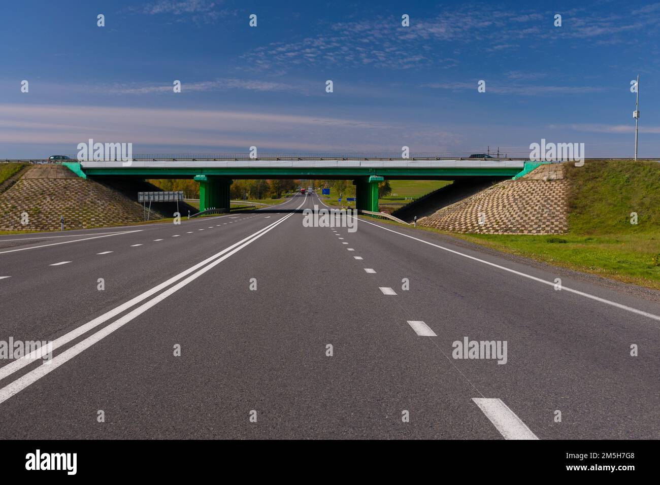 Bridge, roadside and asphalt, blue sky in the city streets in public ...