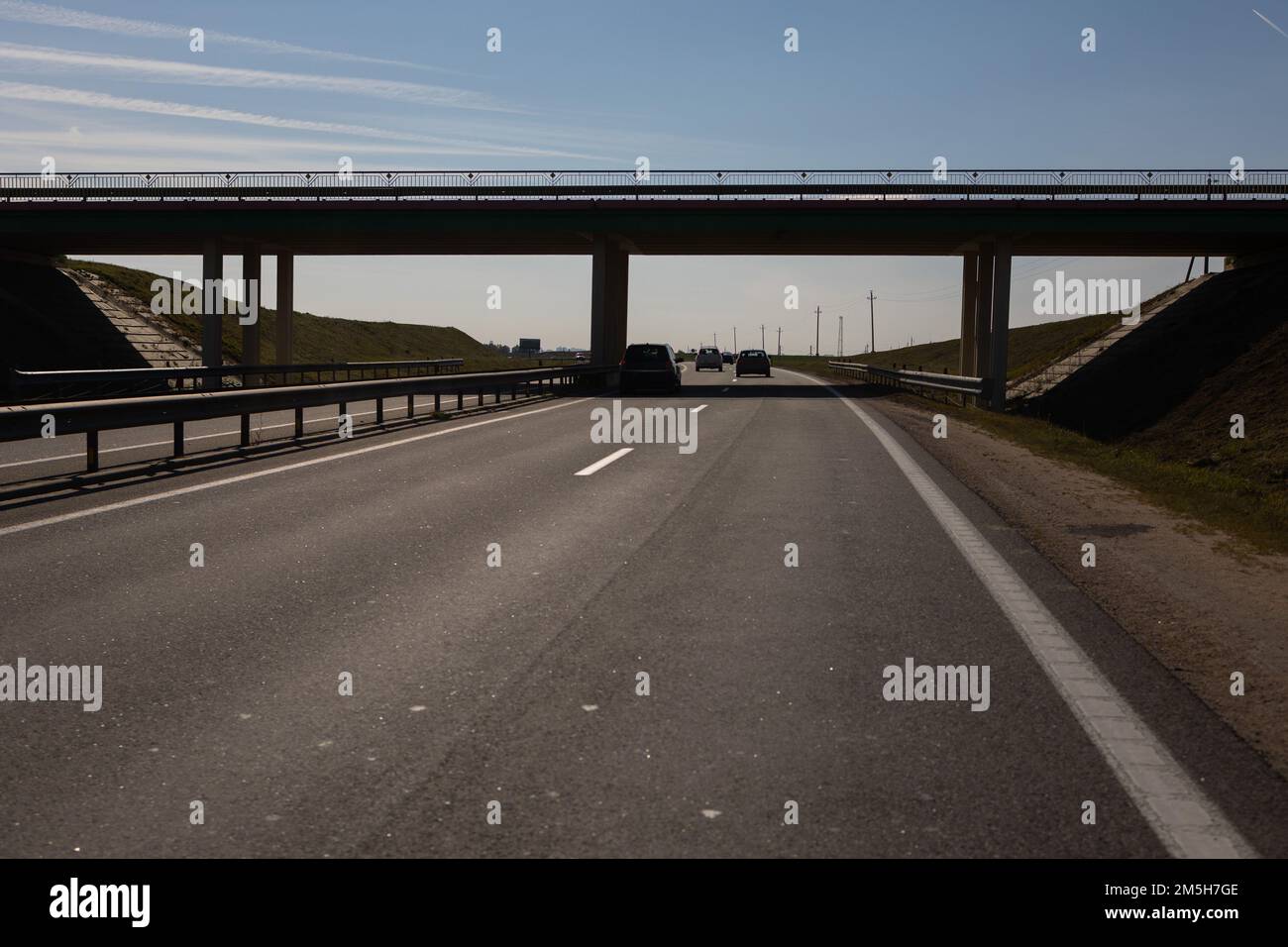 Bridge, roadside and asphalt, blue sky in the city streets in public ...